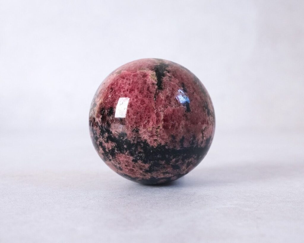 Do I Need Rhodonite? Meaning and Healing Properties - Symbol Sage